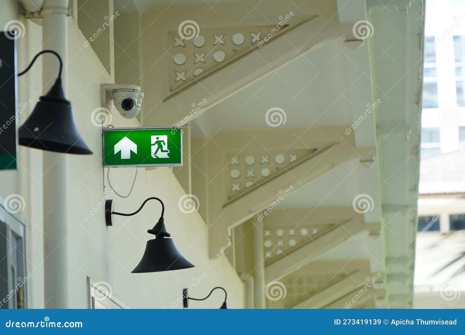 Fire Exit Signs with CCTV Outside the Building Stock Image - Image of ...
