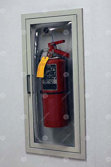 Fire Extinguisher Behind Glass Stock Photo - Image of door, handle: 6408304