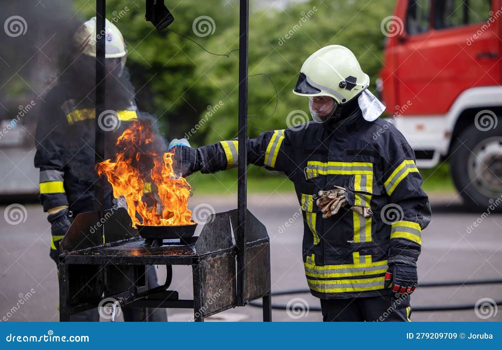 Fire Extinguisher Demonstration with Burning Fire Editorial Stock Image ...
