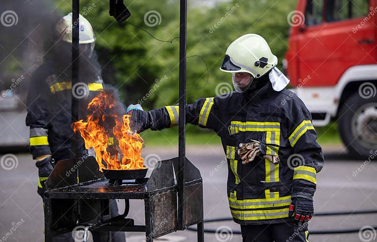 Fire Extinguisher Demonstration with Burning Fire Editorial Stock Image ...