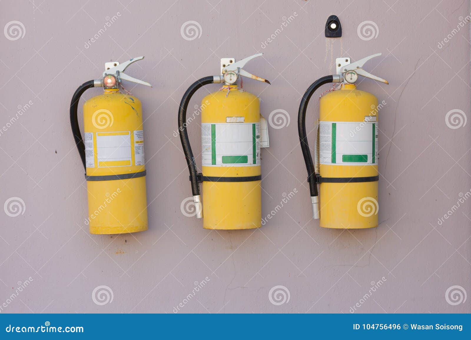 Fire Extinguisher Hanging on the Wall Stock Photo - Image of canister ...