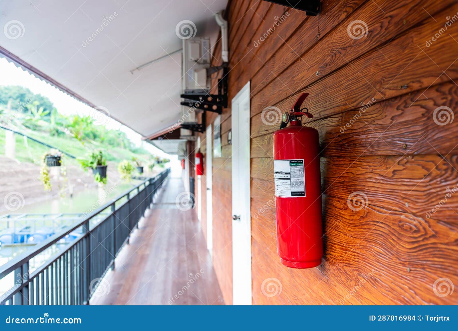 Fire Extinguisher Hanging at Wooden Wall Stock Photo - Image of ...