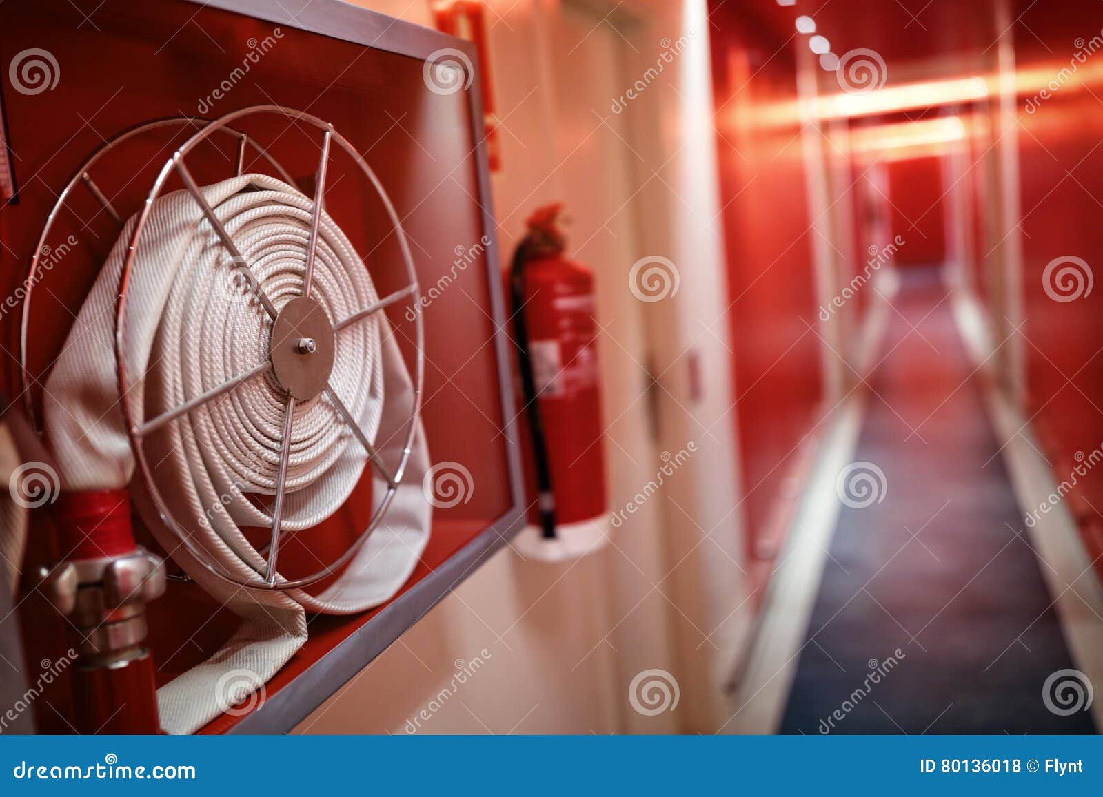Fire Extinguisher and Hose Reel in Hotel Corridor Stock Photo - Image ...