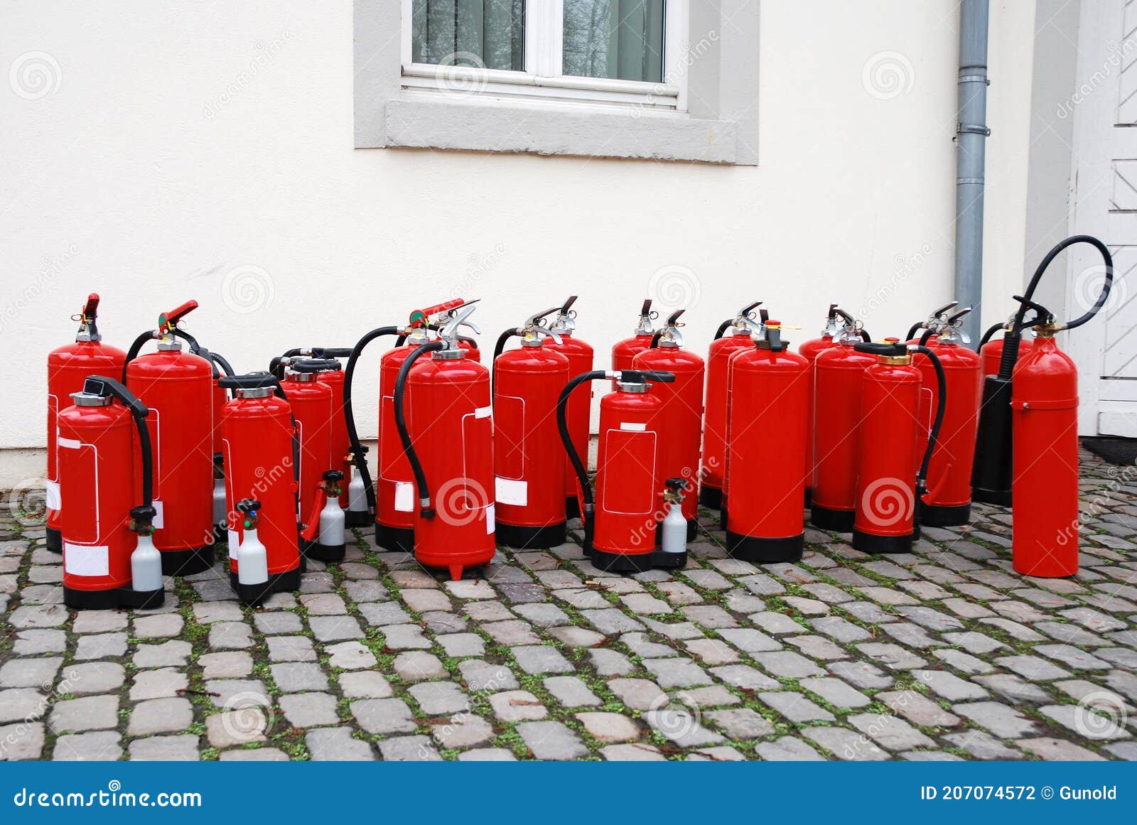 A Row of Fire Extinguishers Stock Photo - Image of chemical ...