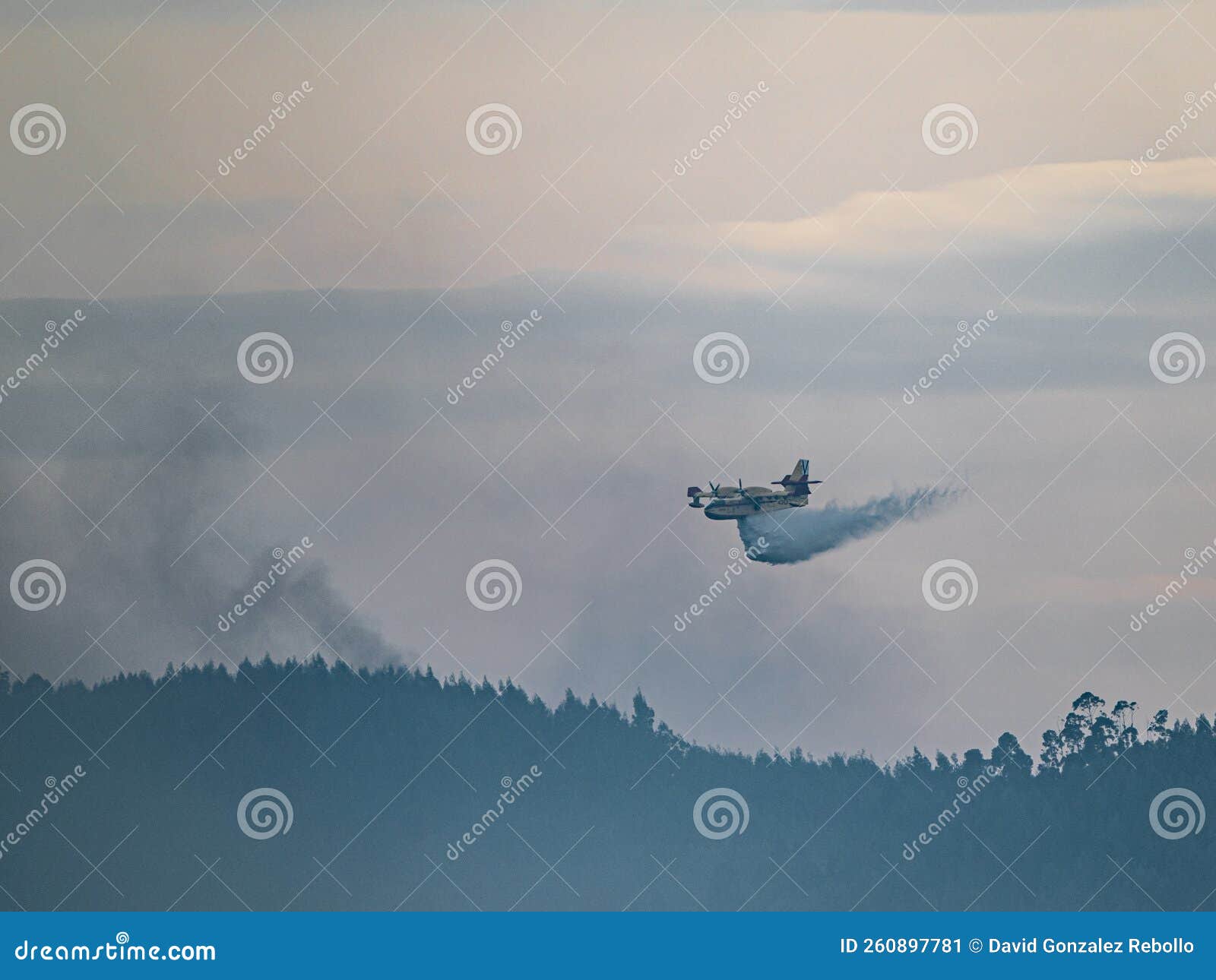 Fire Extinguishing Plane Water Bomber Dumping Its Load, Spain Stock ...