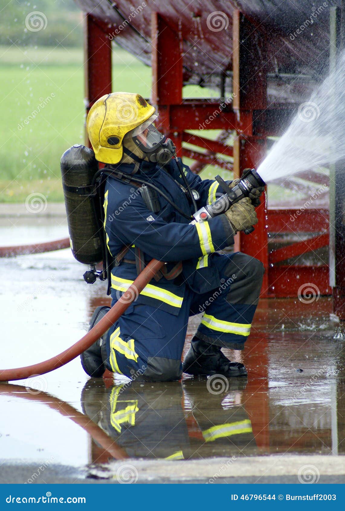 Fire-fighter with hose editorial stock image. Image of inferno - 46796544