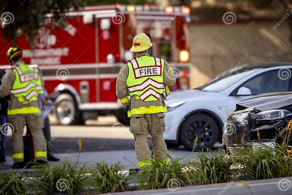 A Fire Fighter Standing at a Car Accident Scene Editorial Photography ...