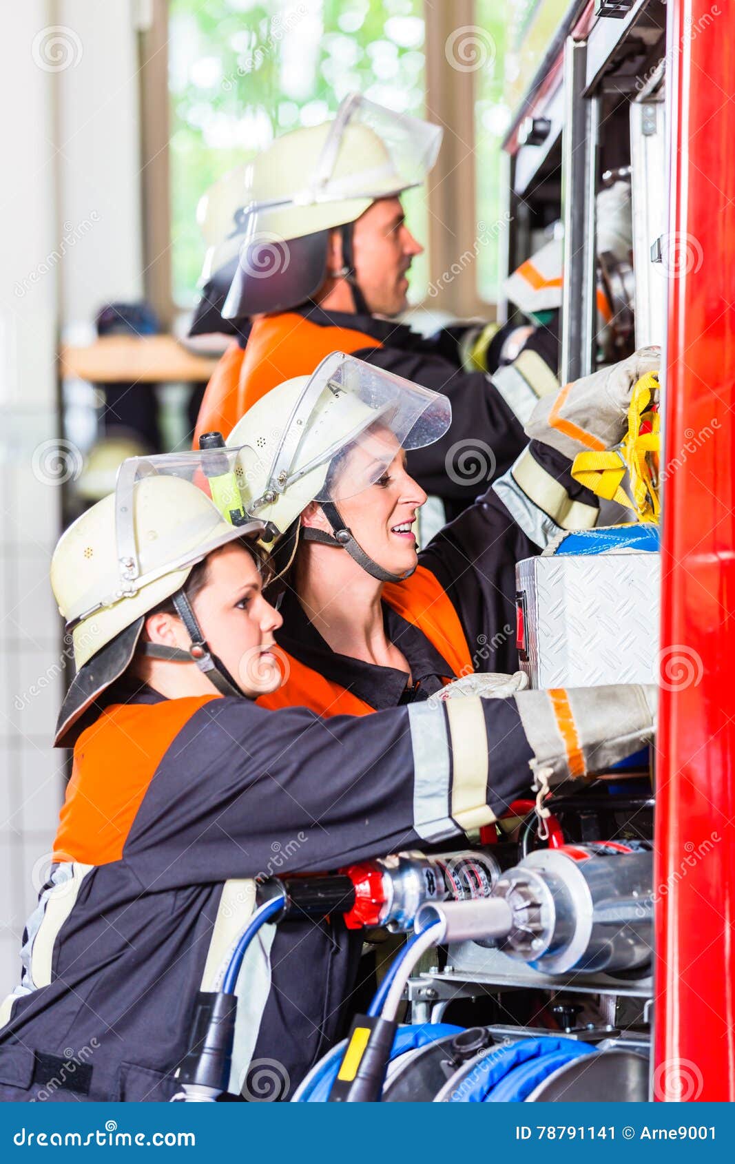 Fire Fighters Attaching Hose at Hose Laying Vehicle Stock Image - Image ...