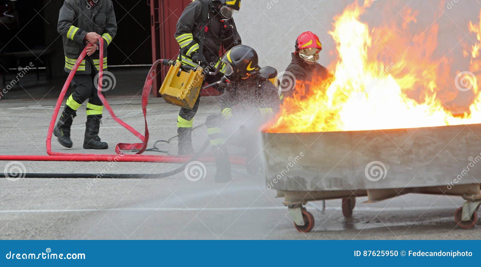 Fire Fighters during the Exercise in the Firehouse To Extinguish Stock ...