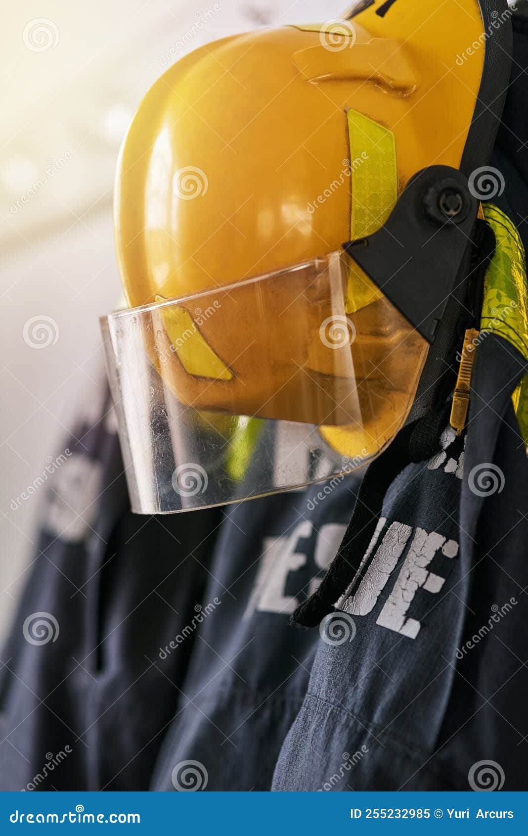 Fire Fighting Gear. Firemens Clothing Hanging from a Wall. Stock Image ...