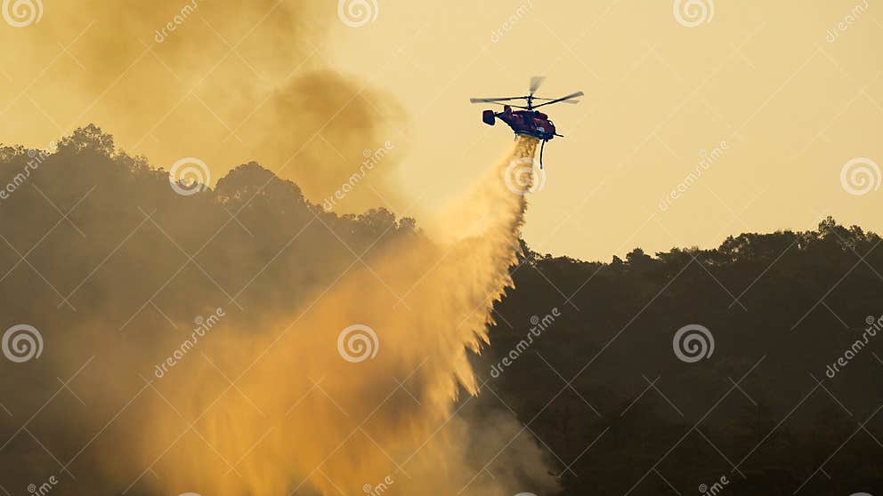 Fire Fighting Helicopter Dropping Water Onto Forest Fire Stock Photo ...