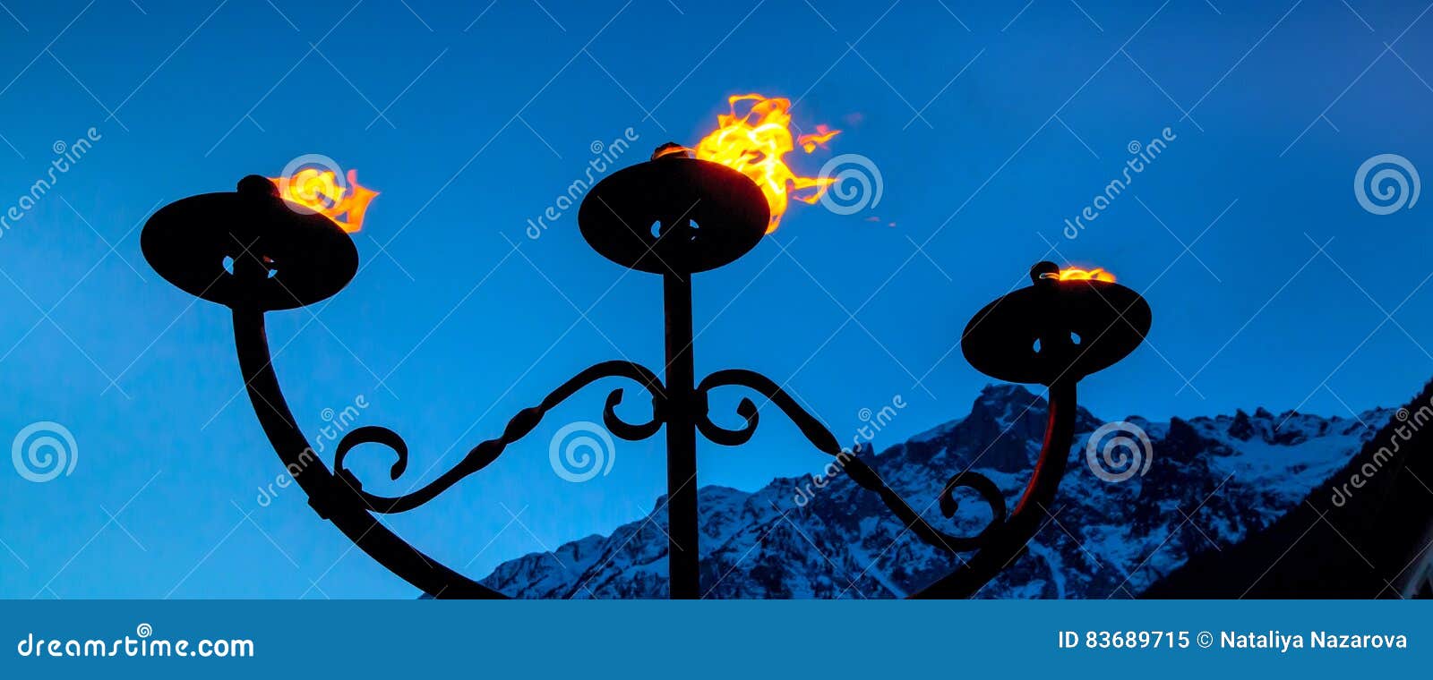 Fire and Flame of Three Torches Burning in the Night Stock Image ...