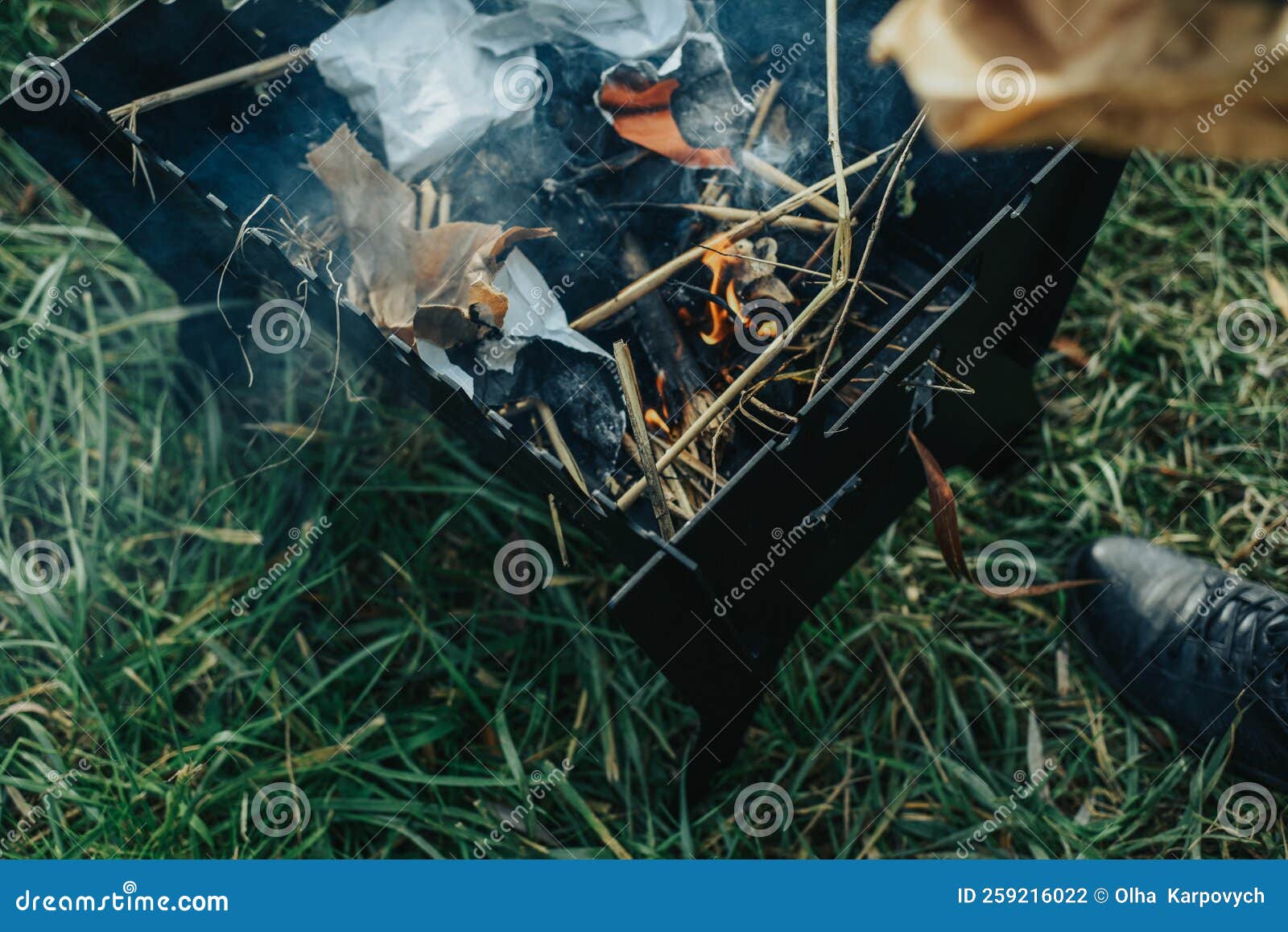 The Fire on the Grill Stands on the Grass. they Make Fire with Paper ...