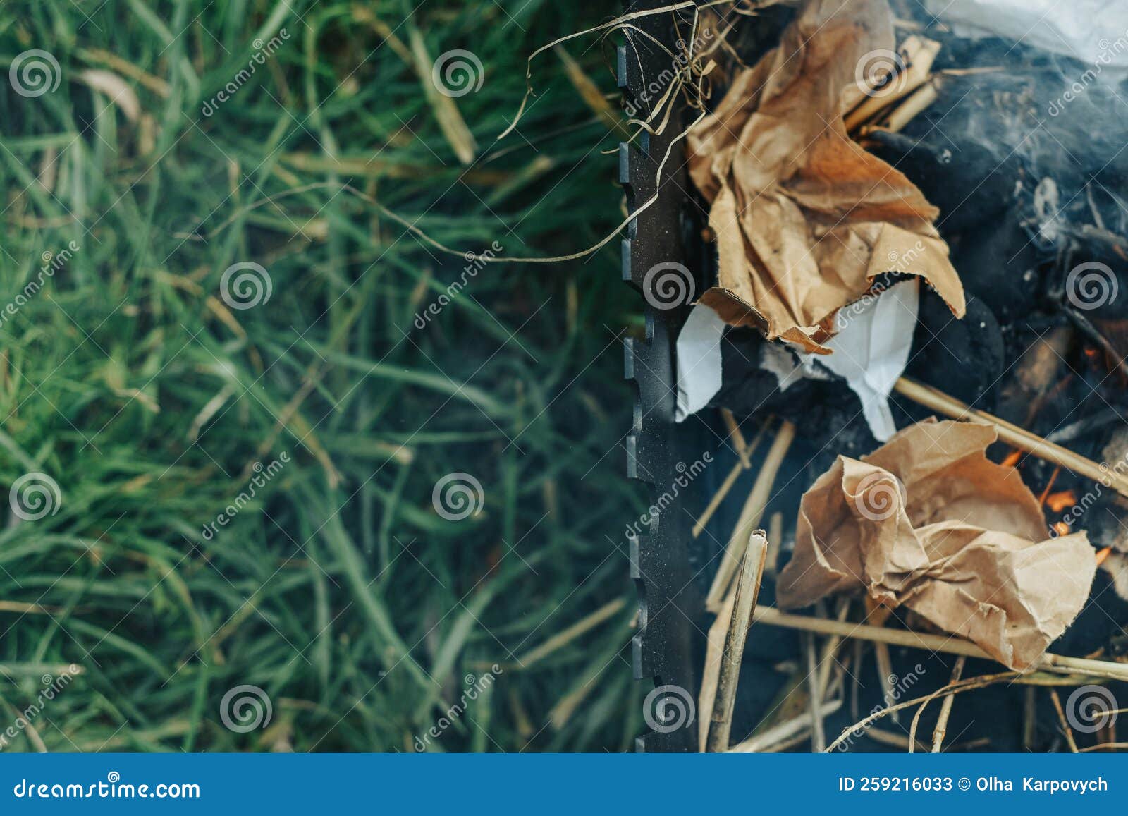 The Fire on the Grill Stands on the Grass. they Make Fire with Paper ...