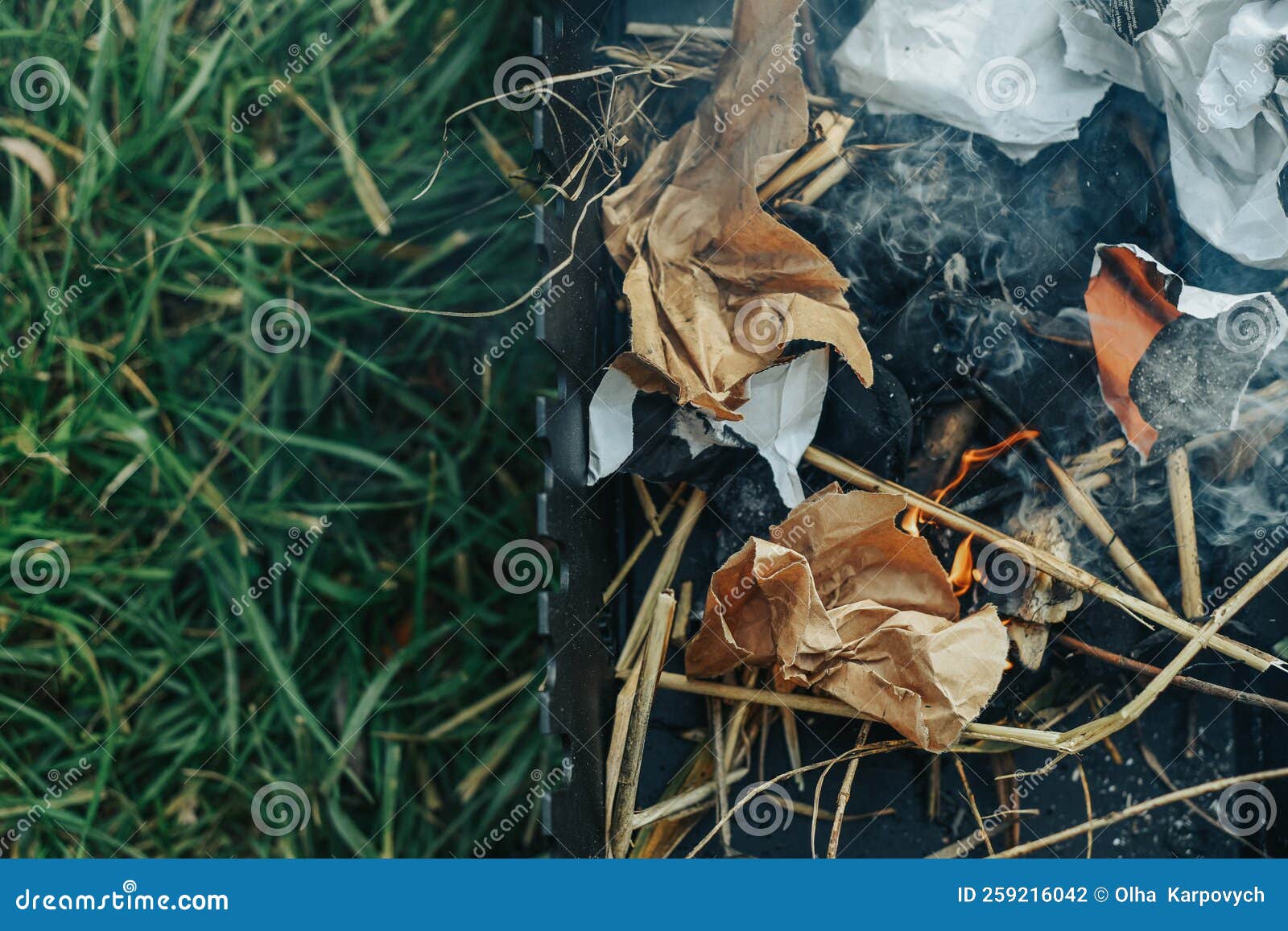 The Fire on the Grill Stands on the Grass. they Make Fire with Paper ...