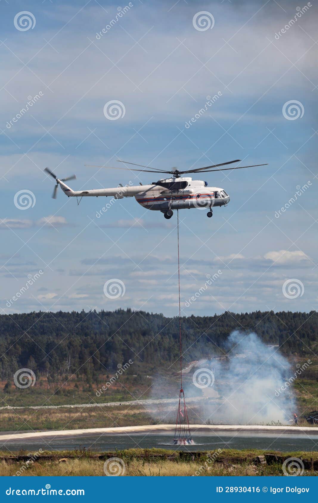 A Fire Helicopter Extinguishes A Forest Fire At Night, Dropping Water ...