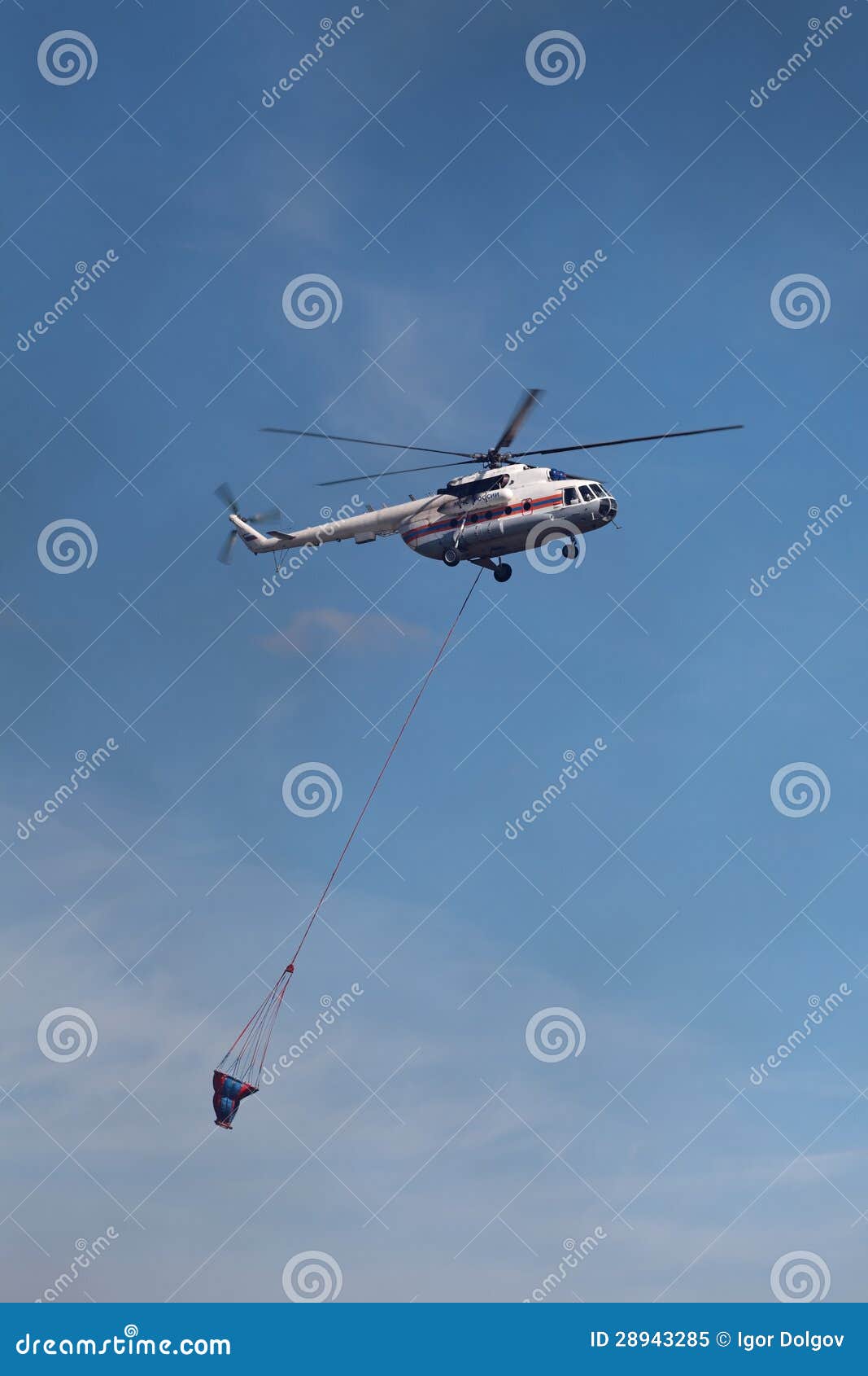 Fire Helicopter Fills The Bambi Bucket With Water While Hovering Over A ...