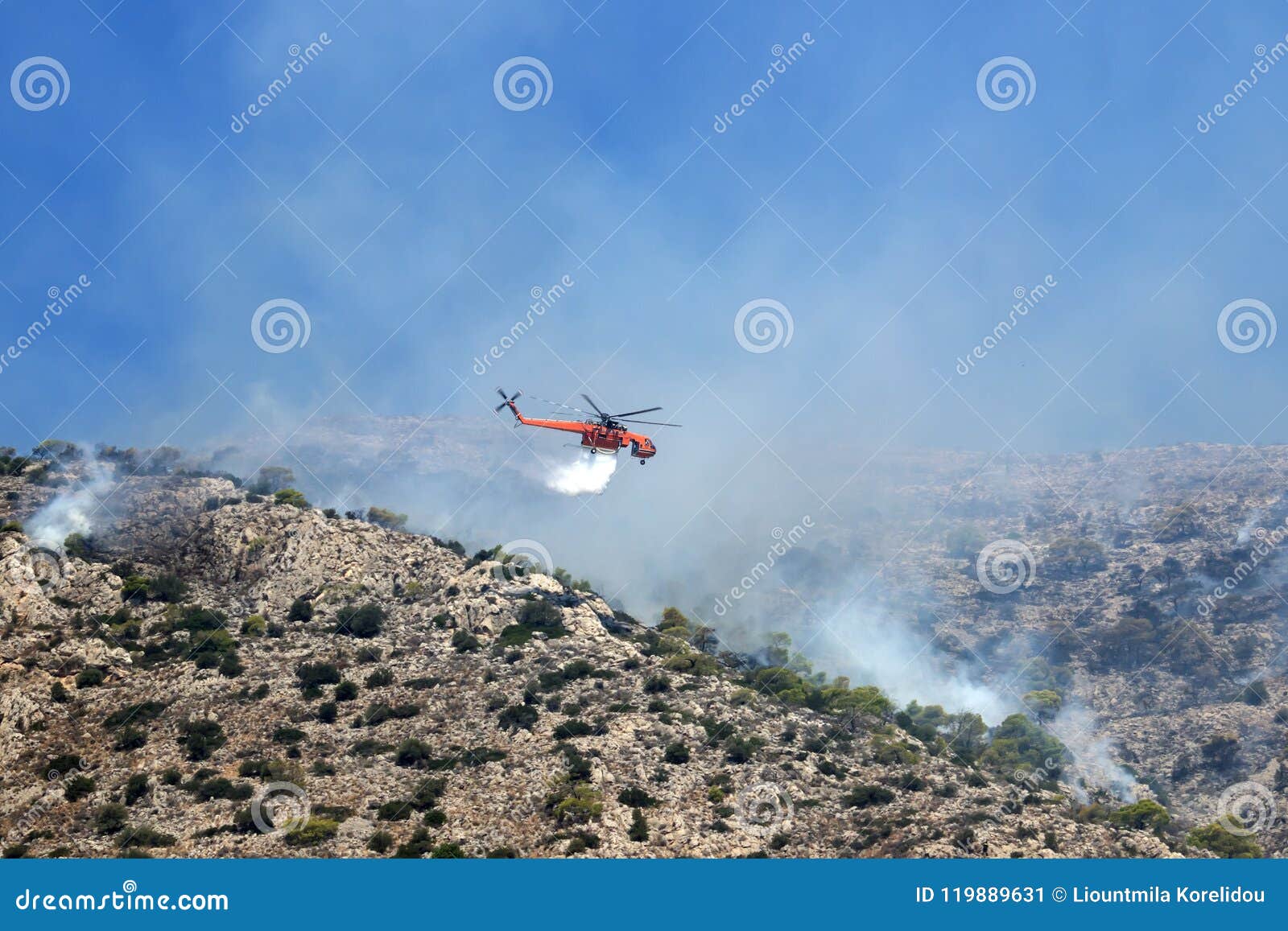 Fire Helicopter Extinguishes the Fire on the Hillside . Greece ...