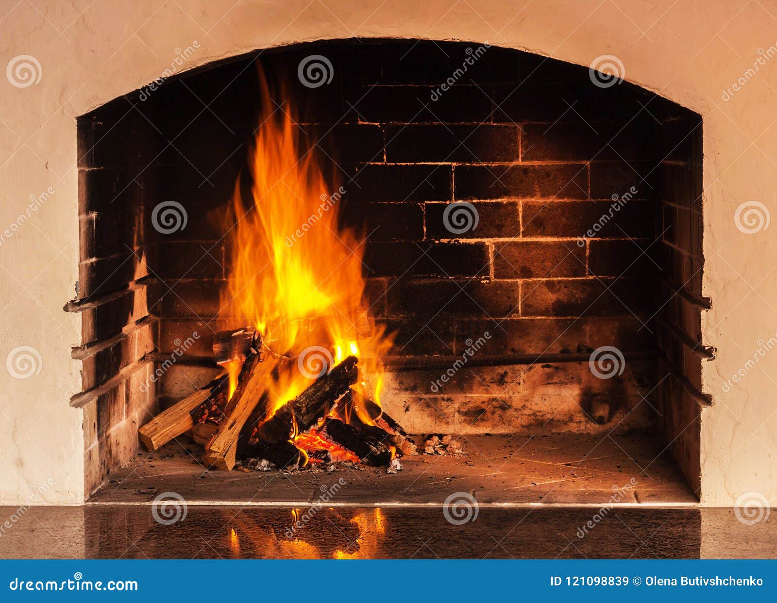 Fire in a Home Fireplace with Reflection on a Stone. Evening Light ...