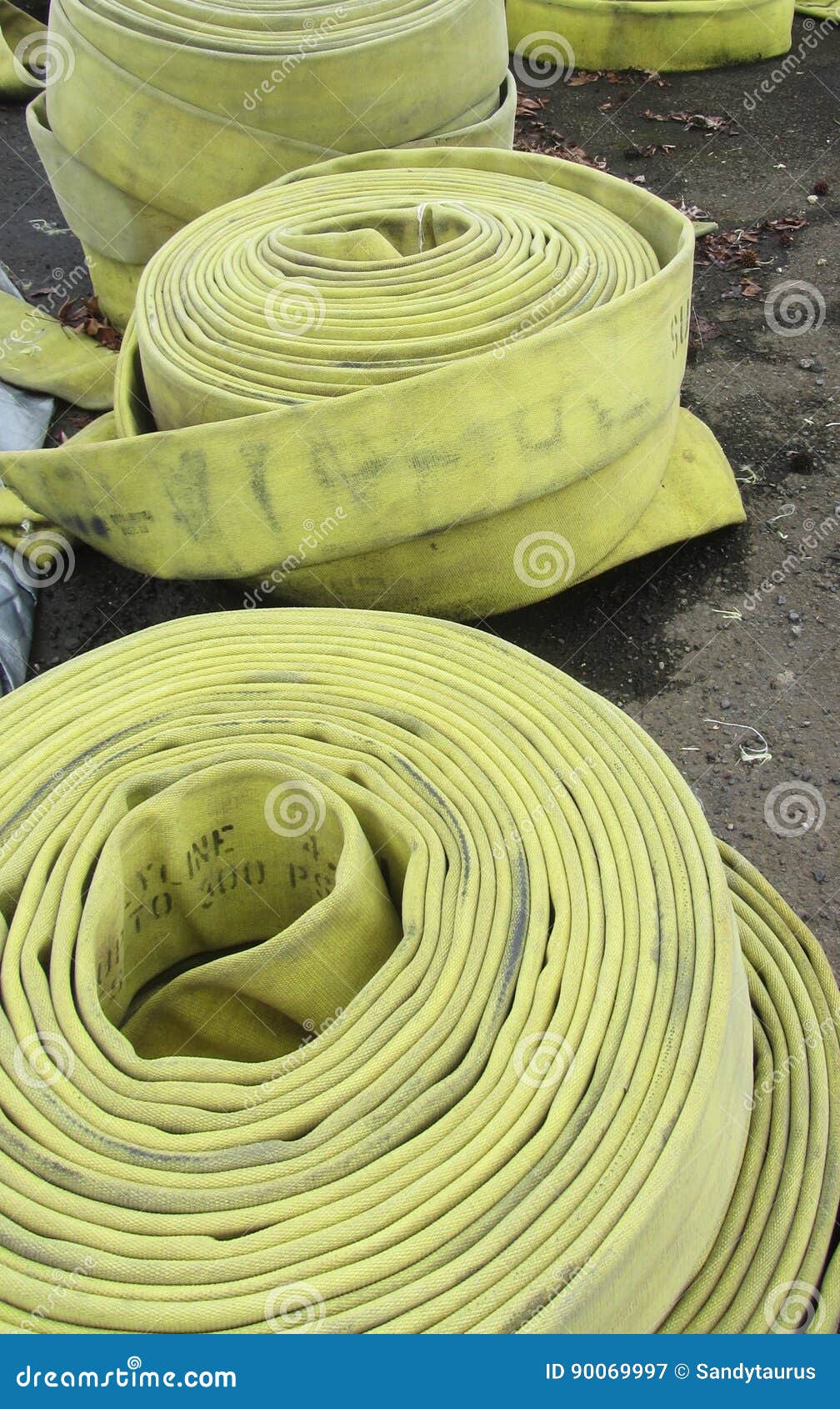 Fire Hose Rolled Up on the Ground Stock Image - Image of danger, hose ...