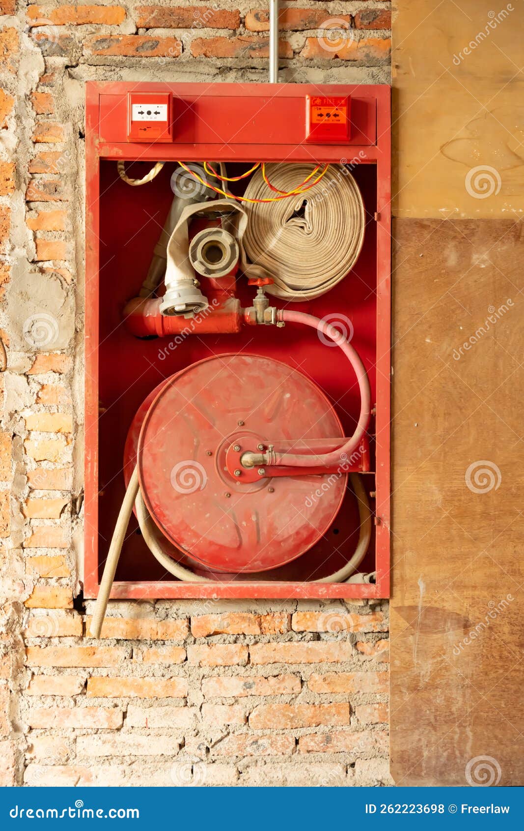 A Fire Hose on the Wall Vertical Composition Stock Photo - Image of ...
