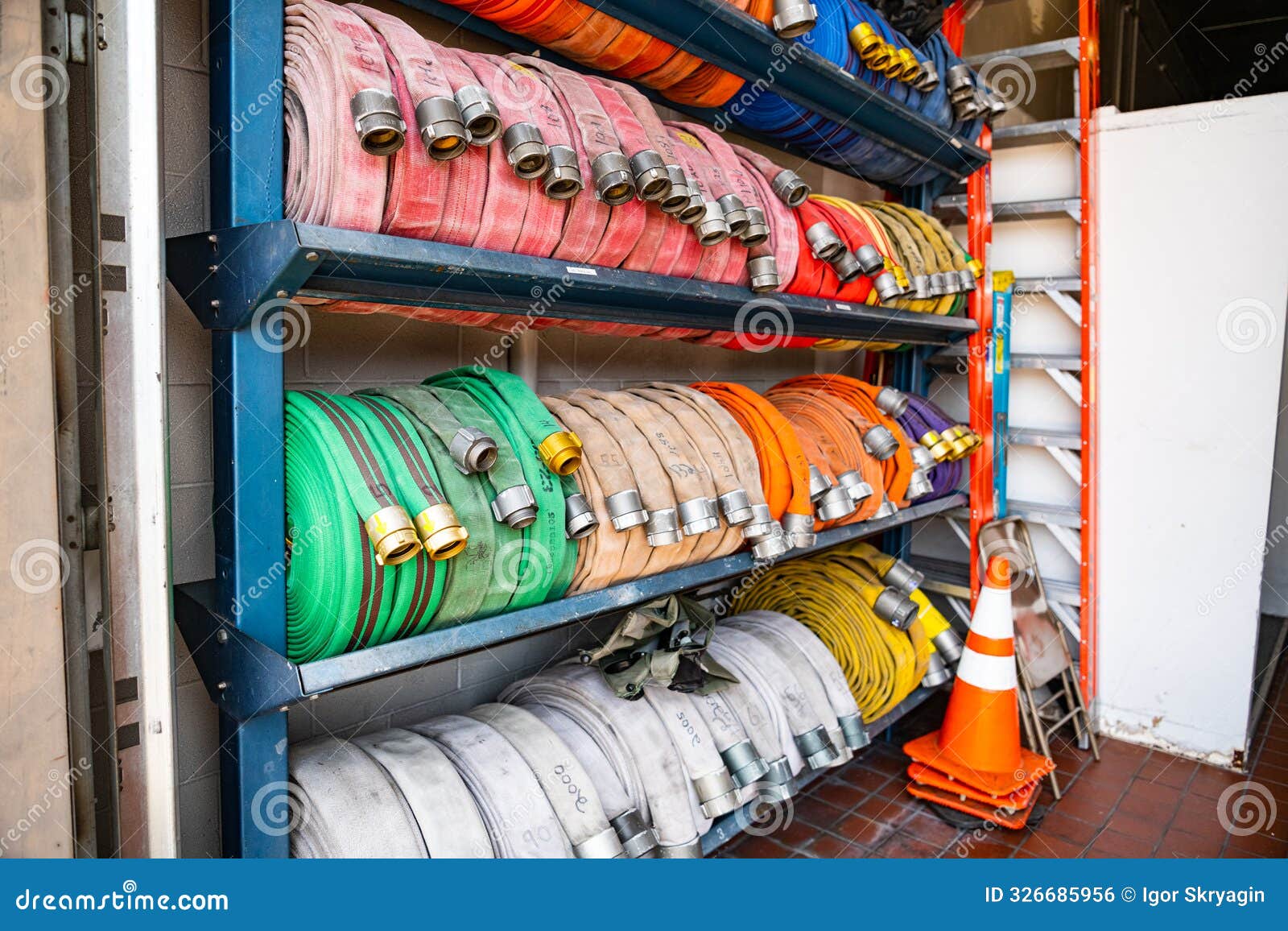 Fire Hoses of Different Colors are Stacked in Rows on a Fire Rack Stock ...