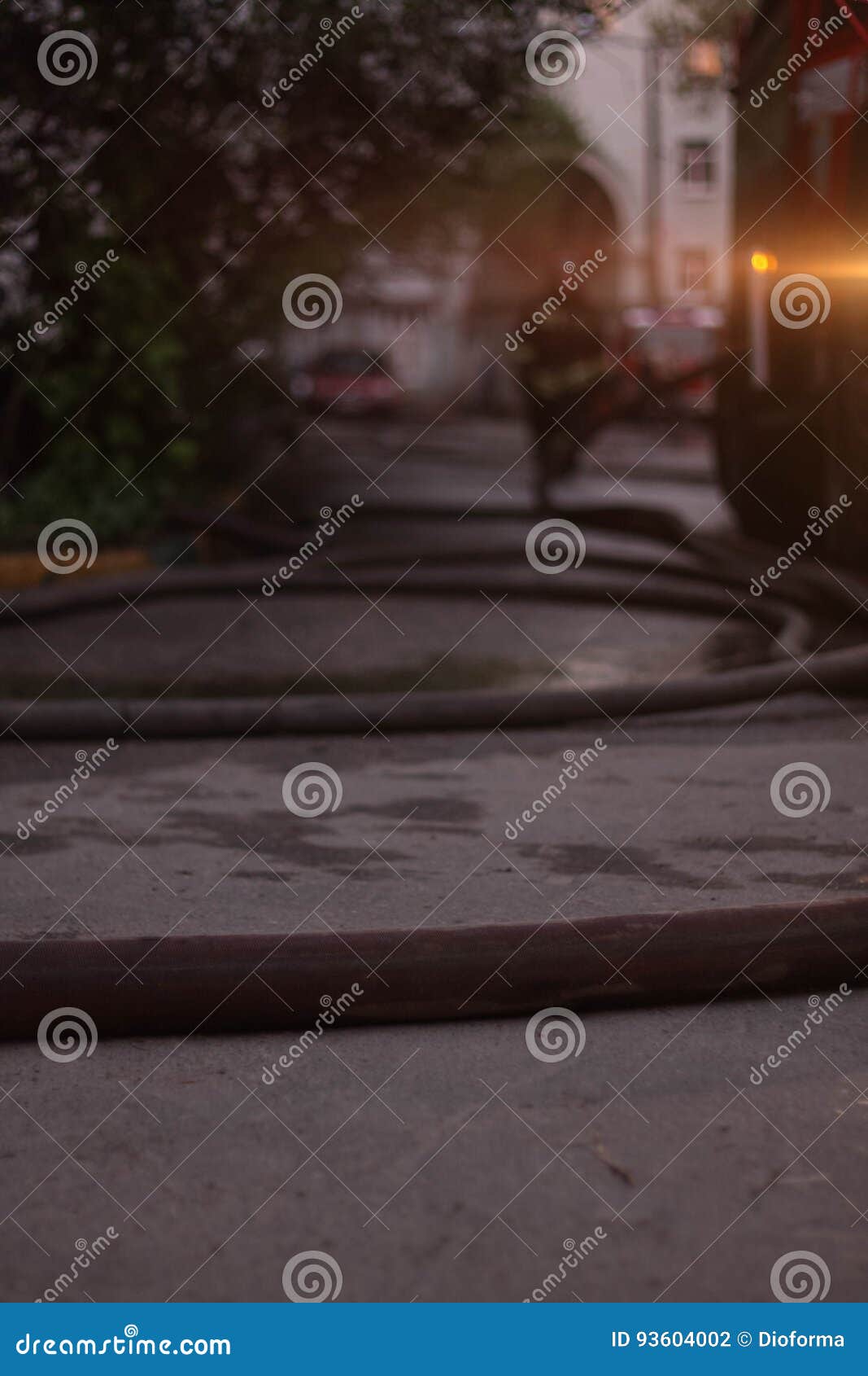 Fire hoses on the pavement stock photo. Image of catastrophe - 93604002