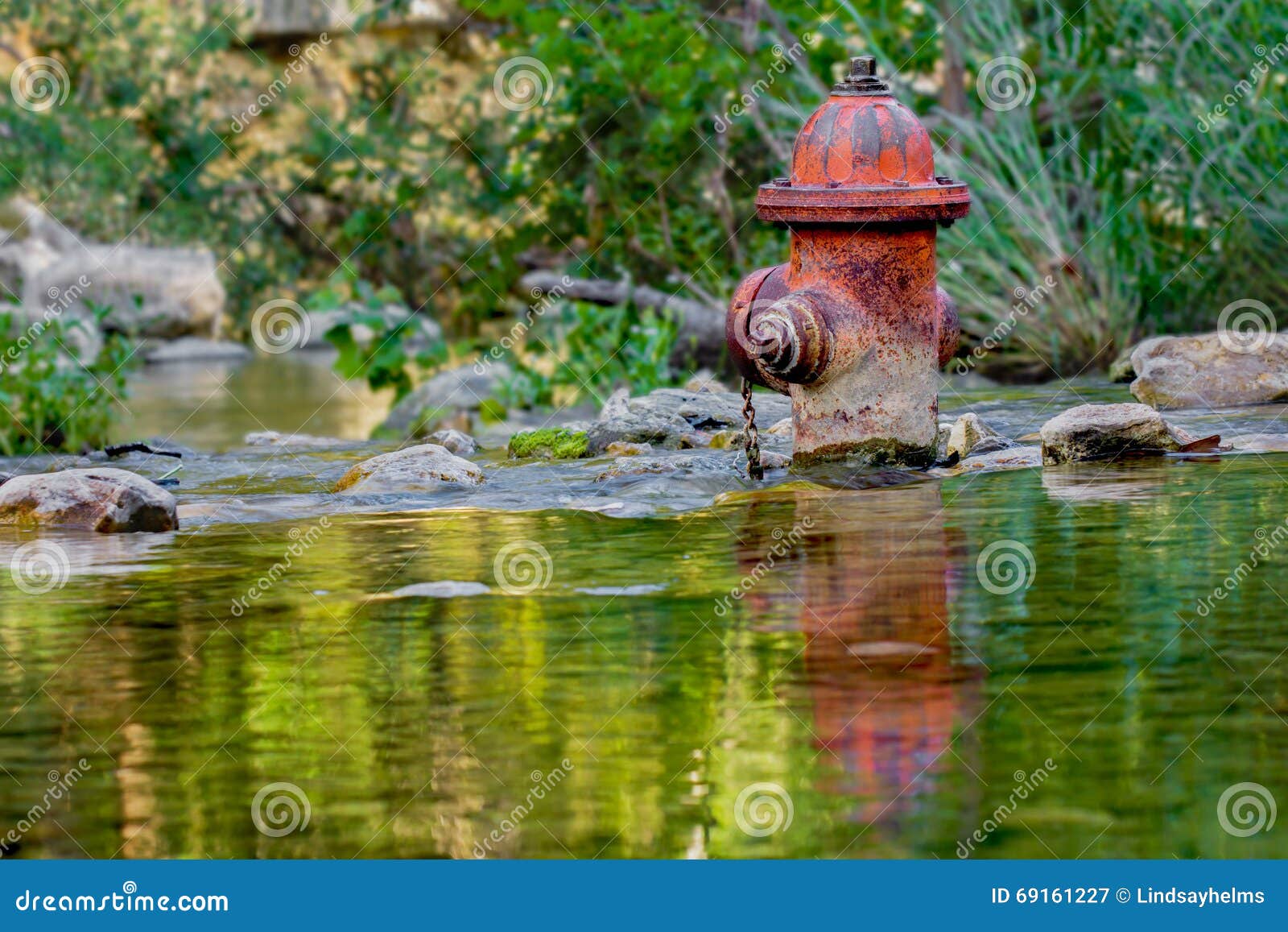 Fire hydrant in creek stock image. Image of construction - 69161227