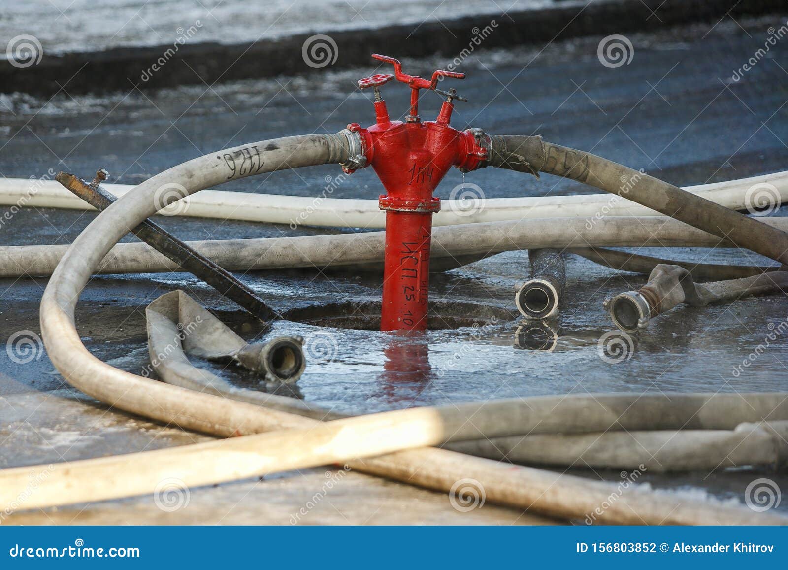 Fire Hydrant with Hoses Floats on the Ground during a Fire ...