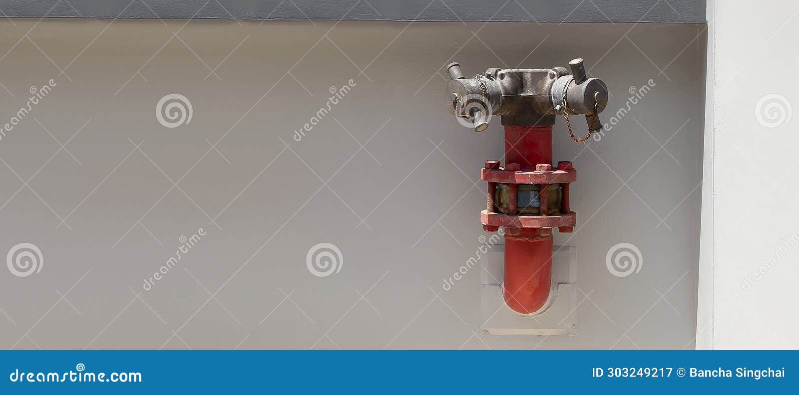 The Fire Hydrant is Installed on the Side of the Building Outside ...