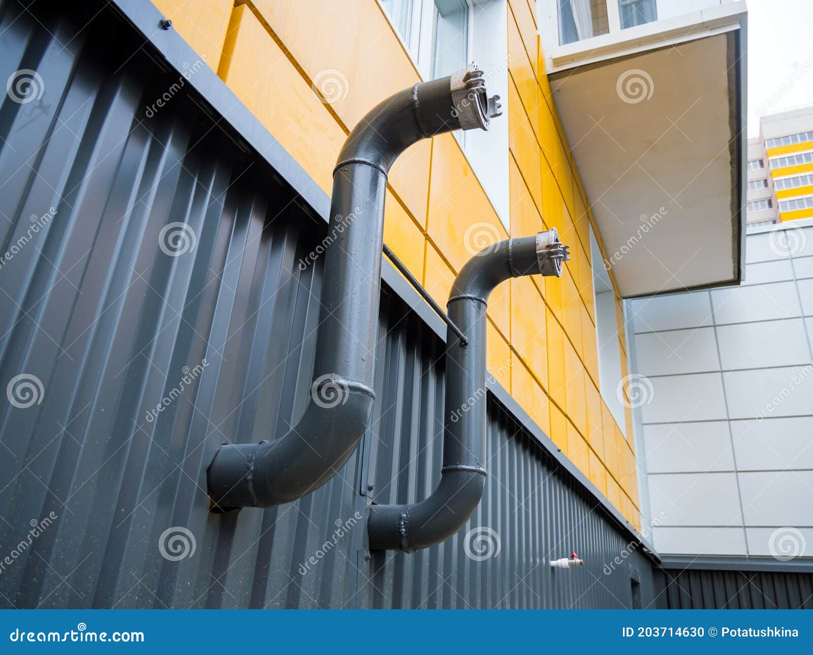 Fire Hydrant Pipes on the Basement of the House Stock Photo - Image of ...