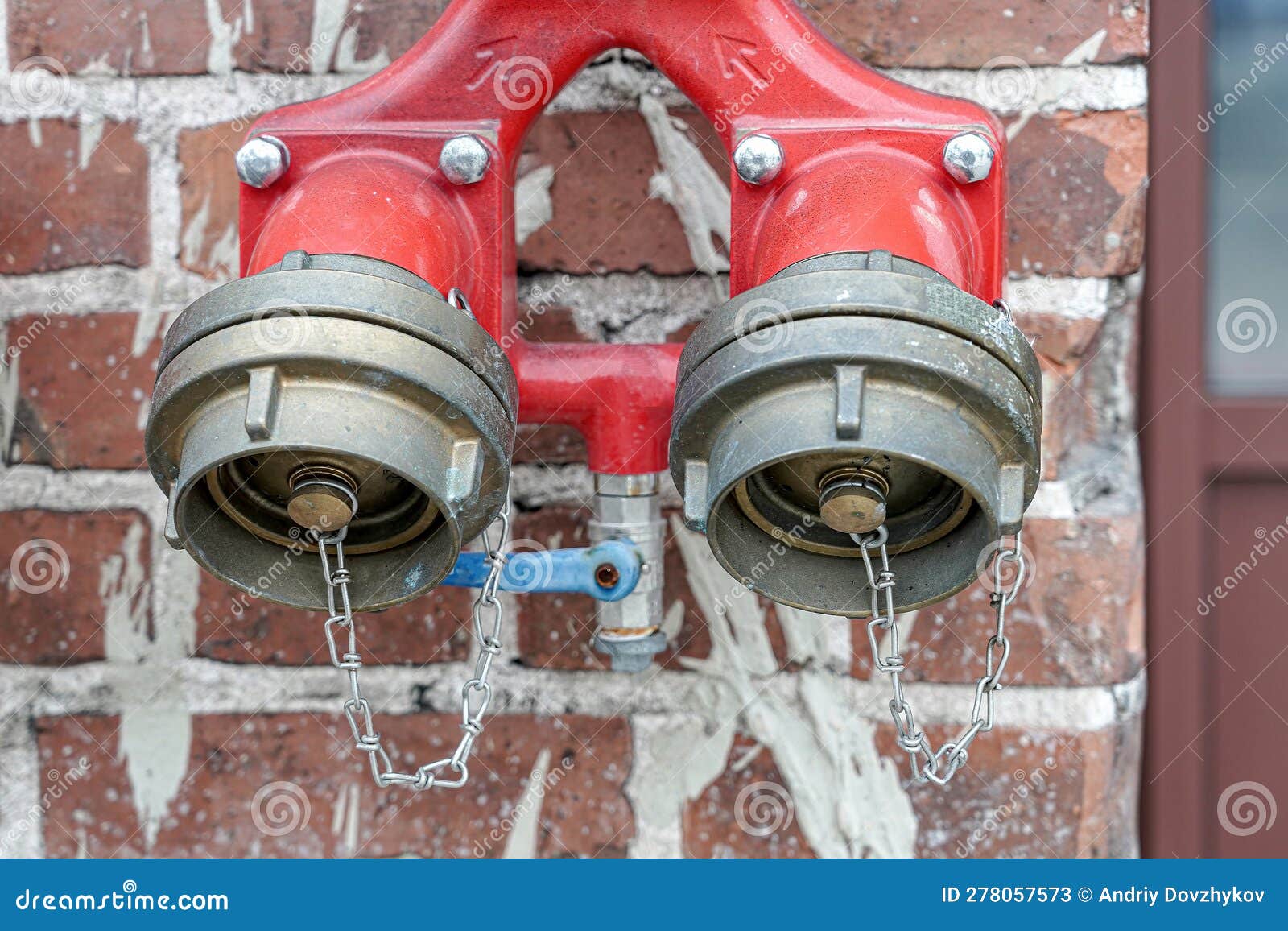 Fire Hydrant for a Quick Set of Water on a Brick Wall. Stock Image ...