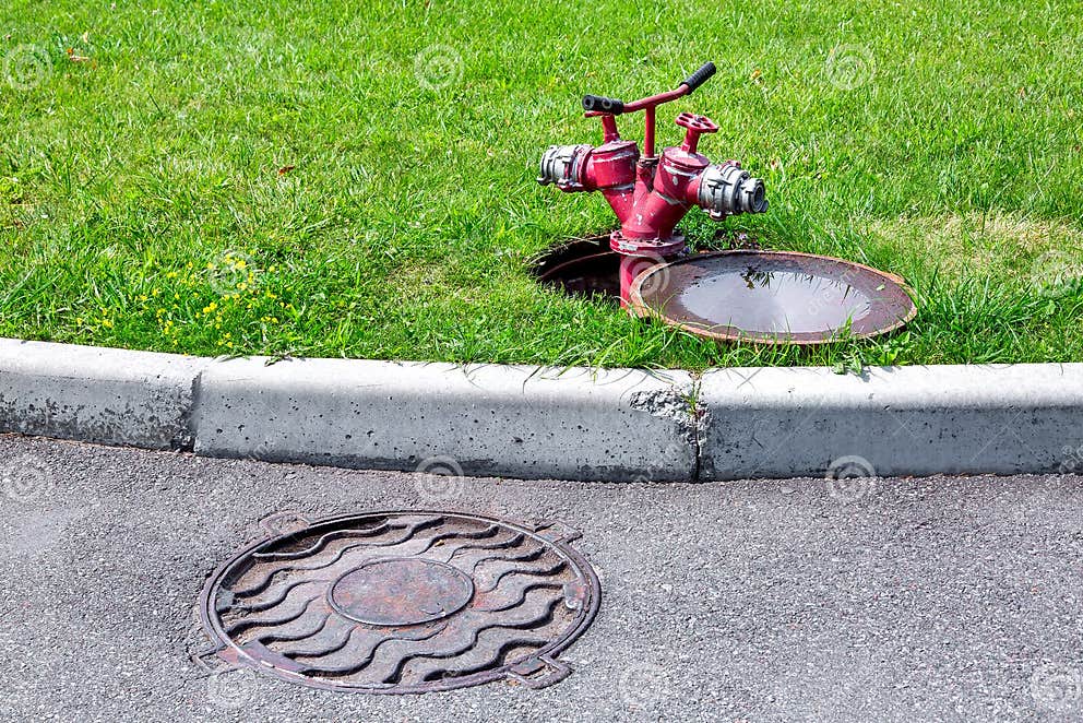 Fire Hydrant Red Pipe with a Gate Connected To an Open Hatch. Stock ...