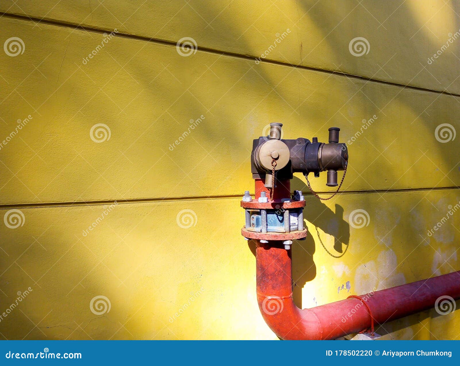 Fire Hydrants on Yellow Wall. Stock Photo - Image of outside, retro ...