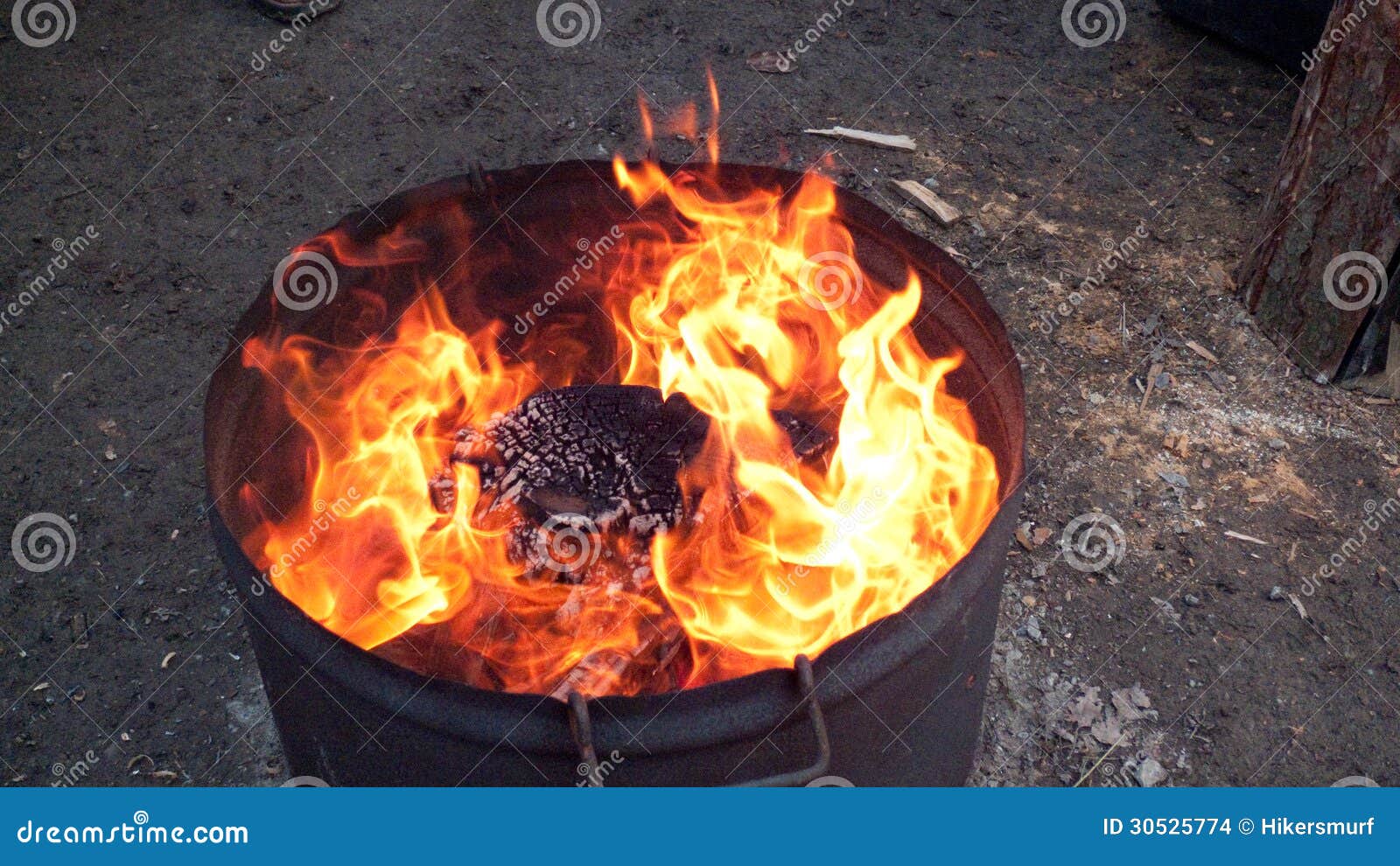 Fire in a Iron barrel stock photo. Image of flame, orange - 30525774