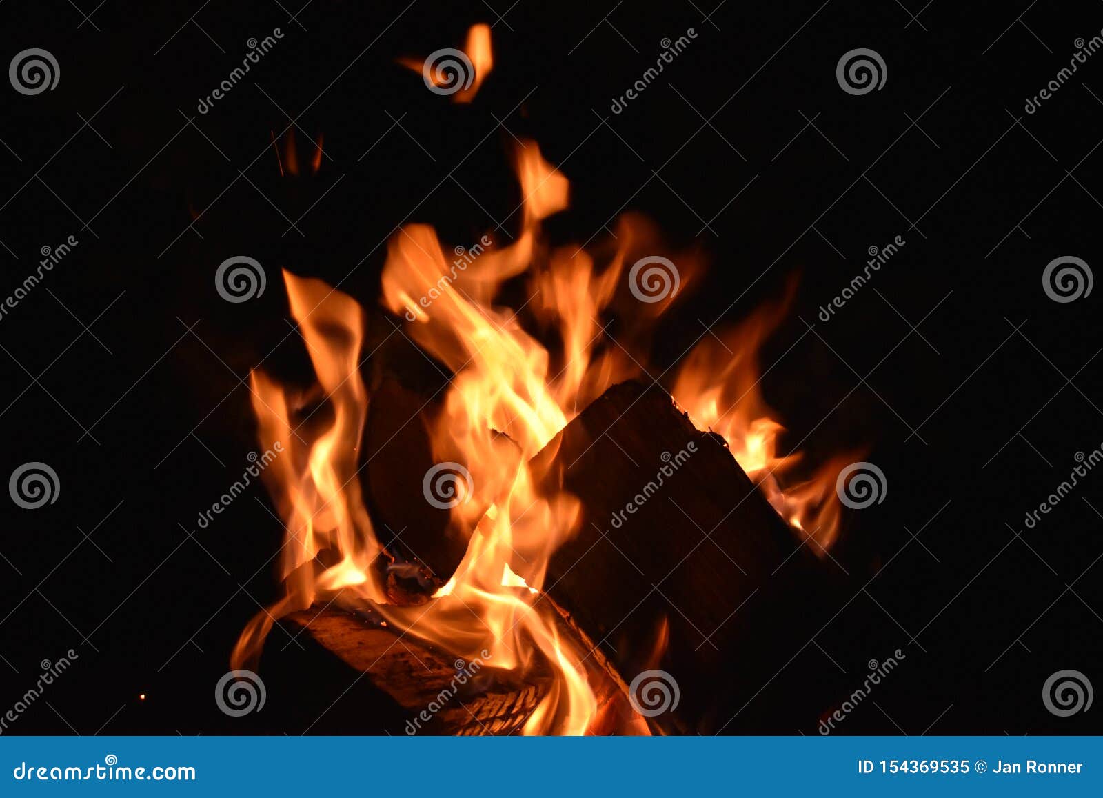 Fire in an iron fire pit stock image. Image of flames - 154369535