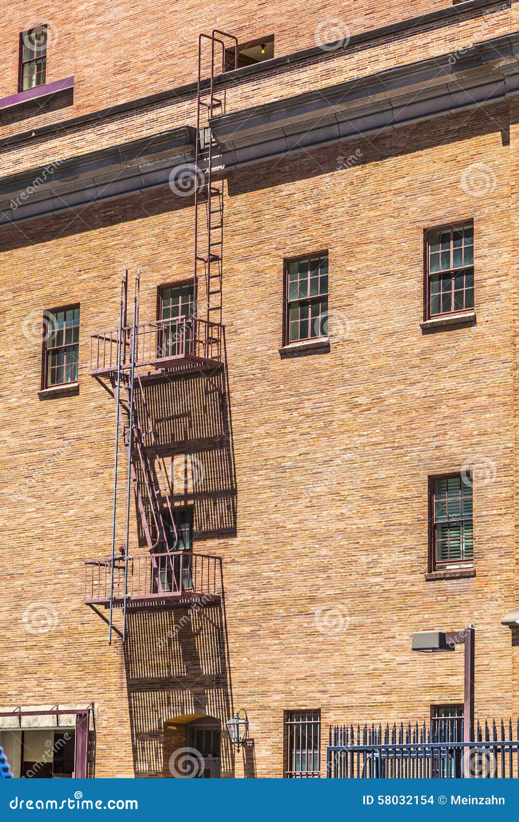 Fire Ladder at an Old Brick House Stock Photo - Image of pattern ...