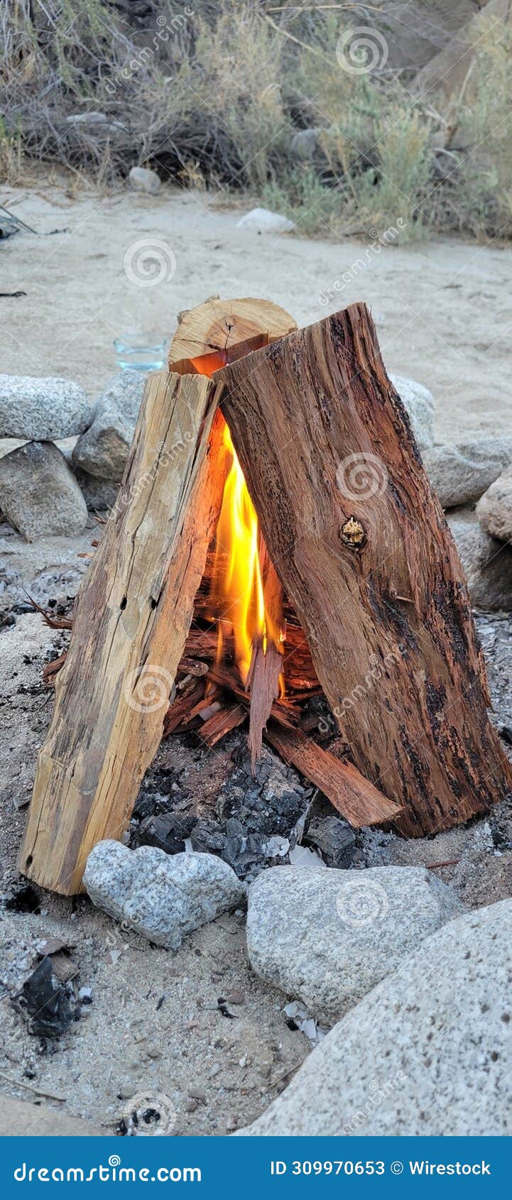 Fire Lit by Rocks and Wood on the Beach Stock Image - Image of seashore ...