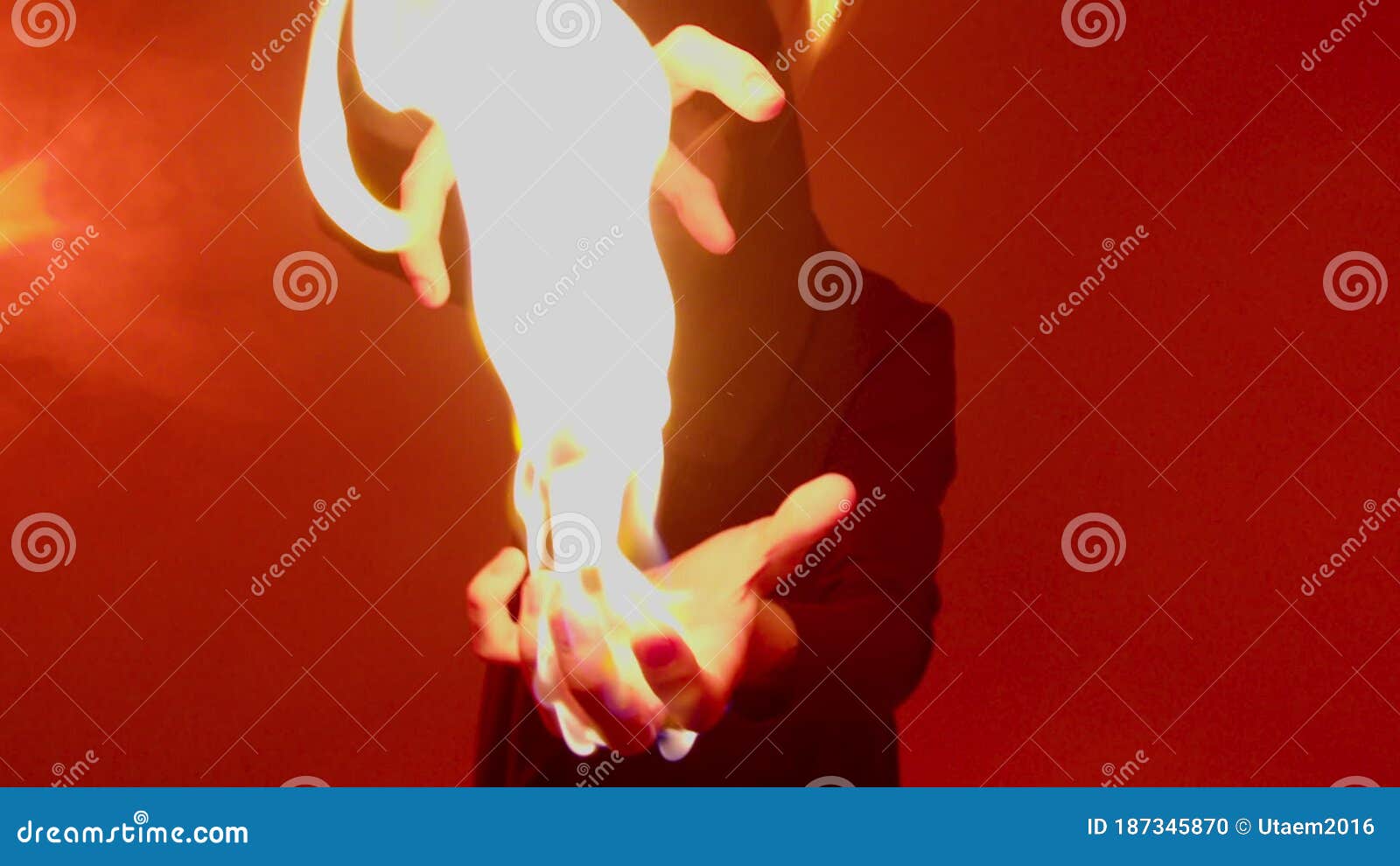 A Fire Mage in a Robe with a Large Hood, Holding His Hands Outstretched ...