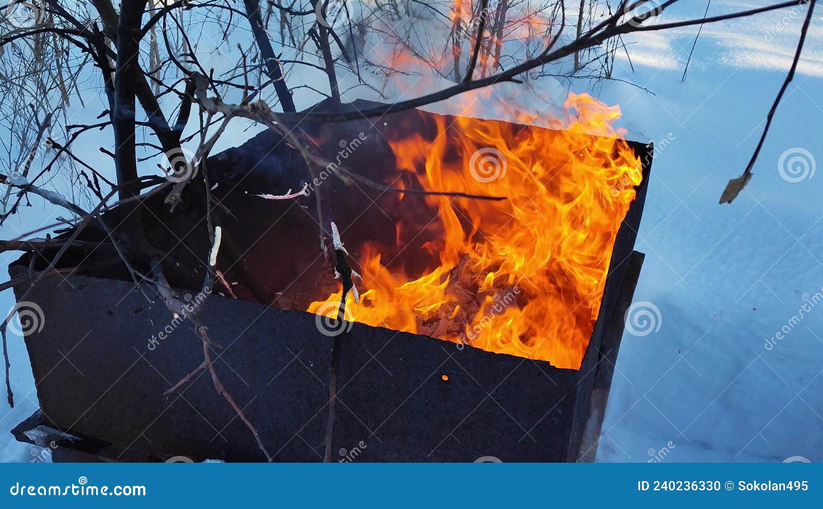 Fire in a Metal Barrel. Burning Garbage in an Iron Container in Winter ...