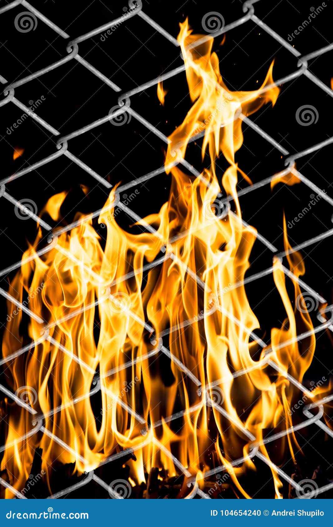 Fire in a metal grid stock photo. Image of mesh, barrier - 104654240