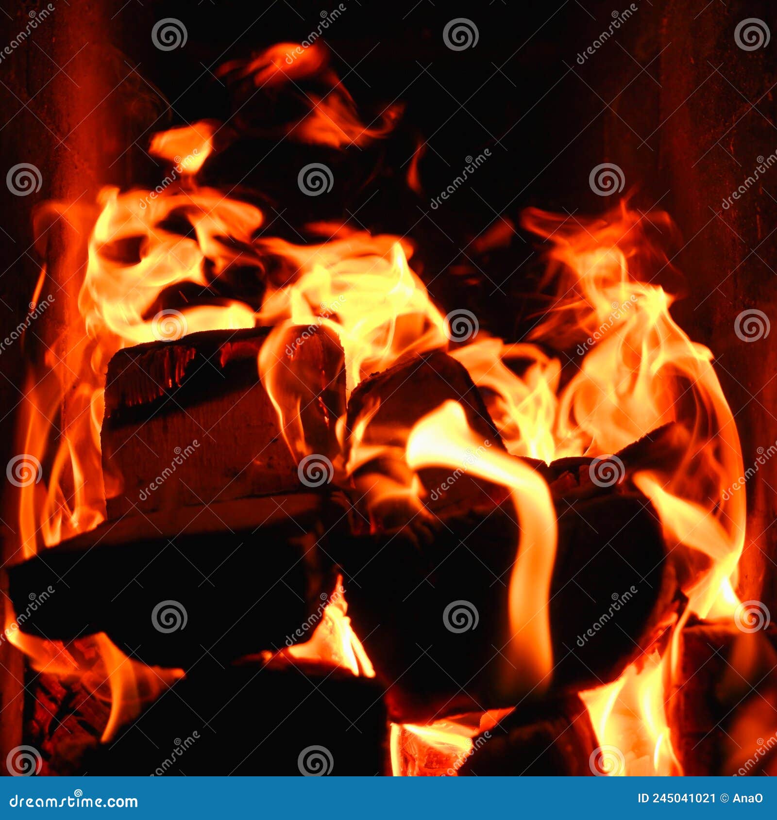 Fire. Photo of Flames Devouring Firewood in a Stone Fireplace. the ...