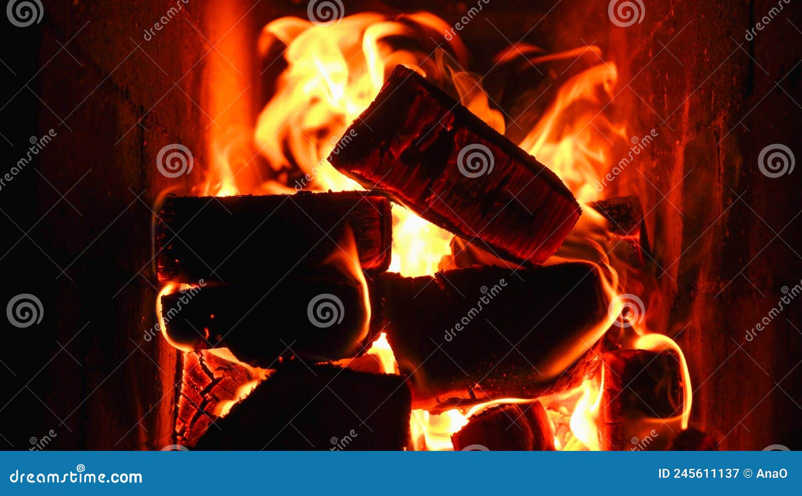 Fire. Photo of Flames Devouring Firewood in a Stone Fireplace. the ...
