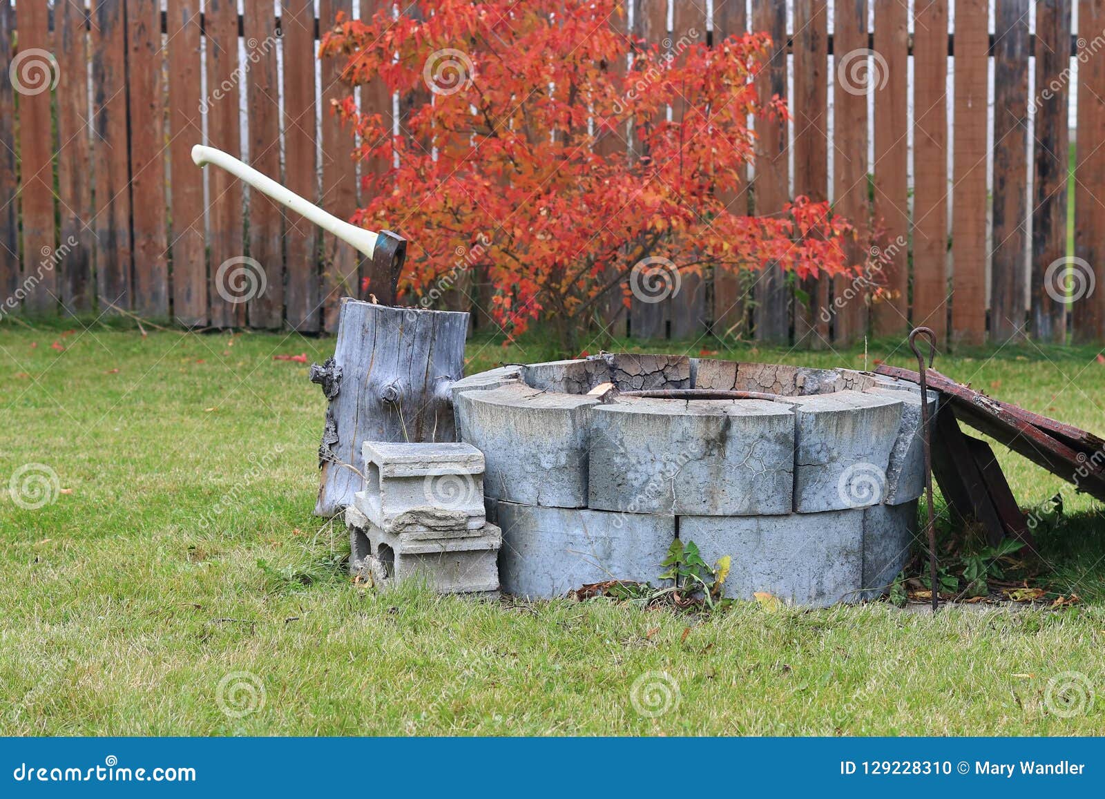 Fire Pit with Red Autumn Trees in the Background Stock Photo - Image of ...
