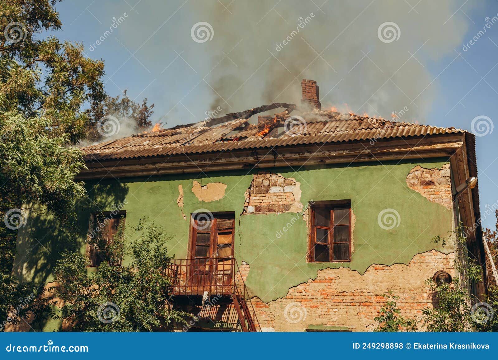 A Fire on the Roof of an Old Abandoned Building Stock Photo - Image of ...