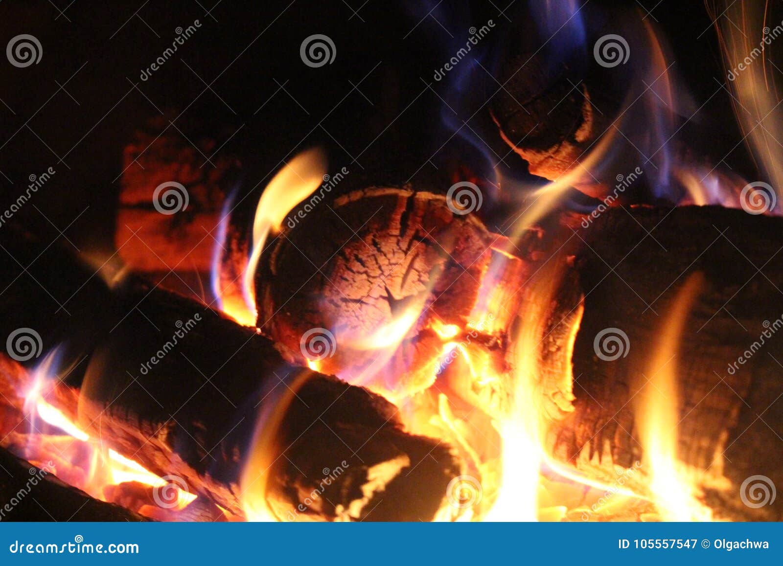 On fire - round end logs stock image. Image of ember - 105557547