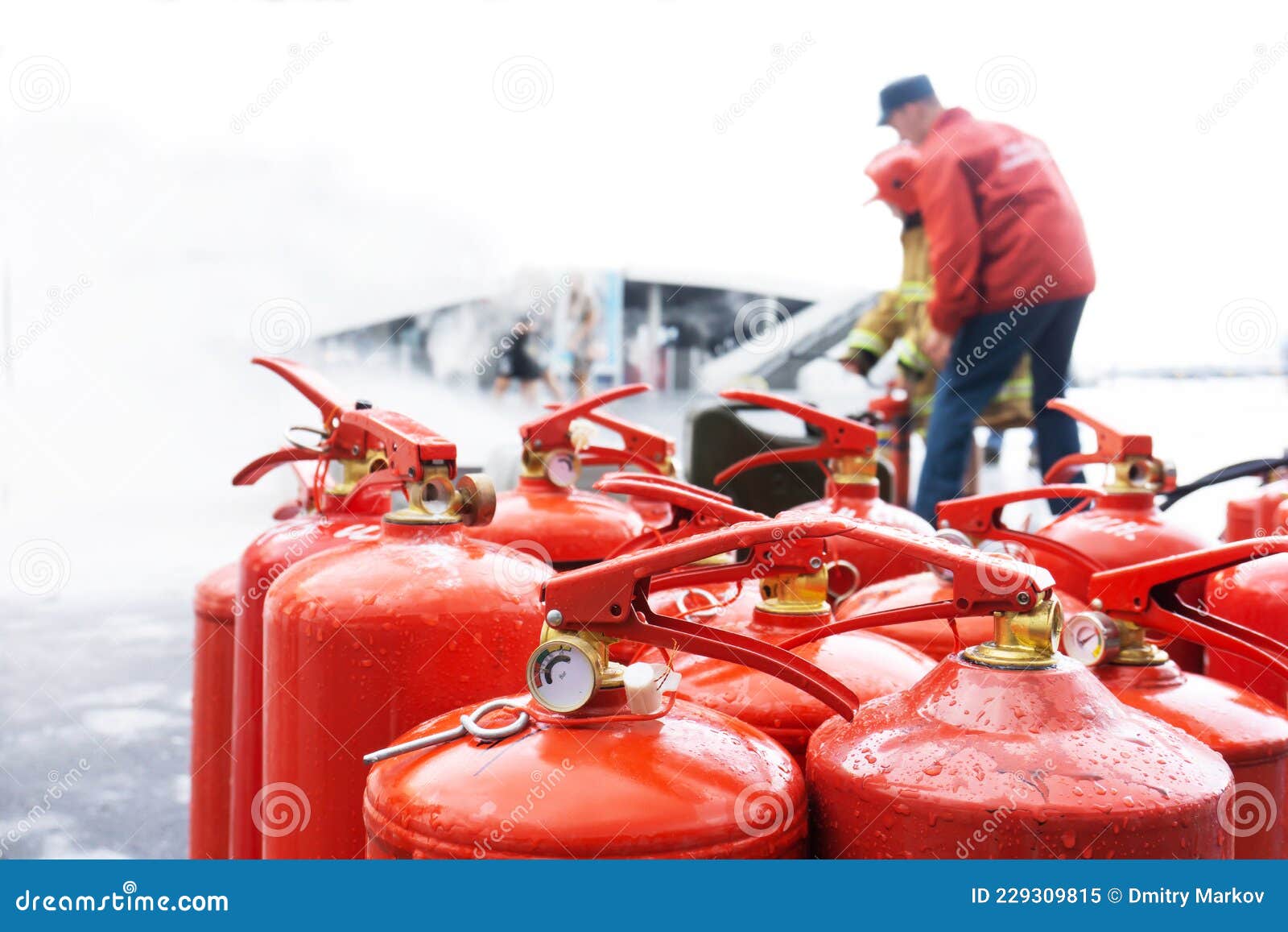 Fire Safety Training Using Fire Extinguishers. Foreground Stock Image ...