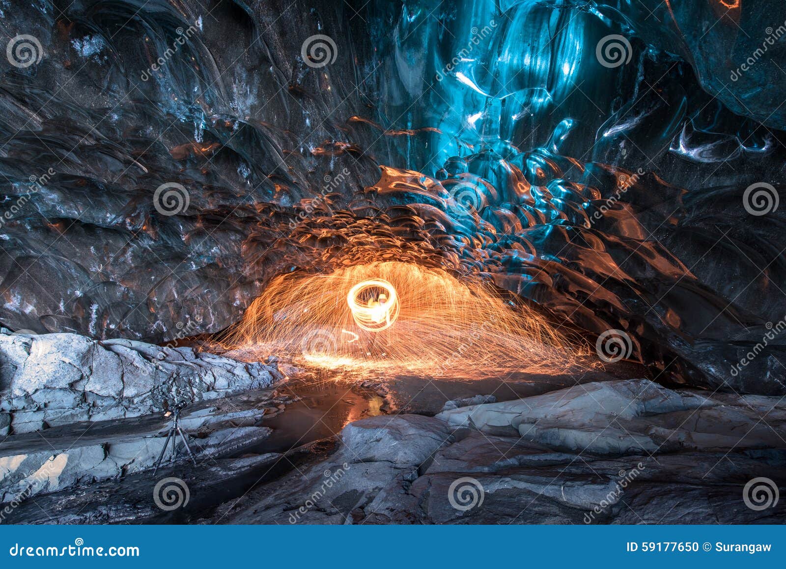 Fire show in the ice cave stock photo. Image of iceberg - 59177650