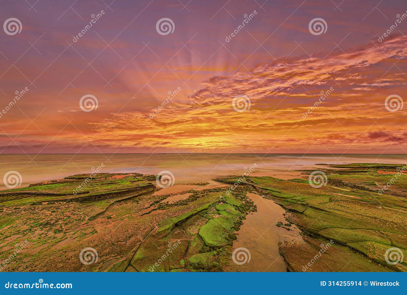 Fire in the Sky with Patches of Green Algae Stock Photo - Image of ...