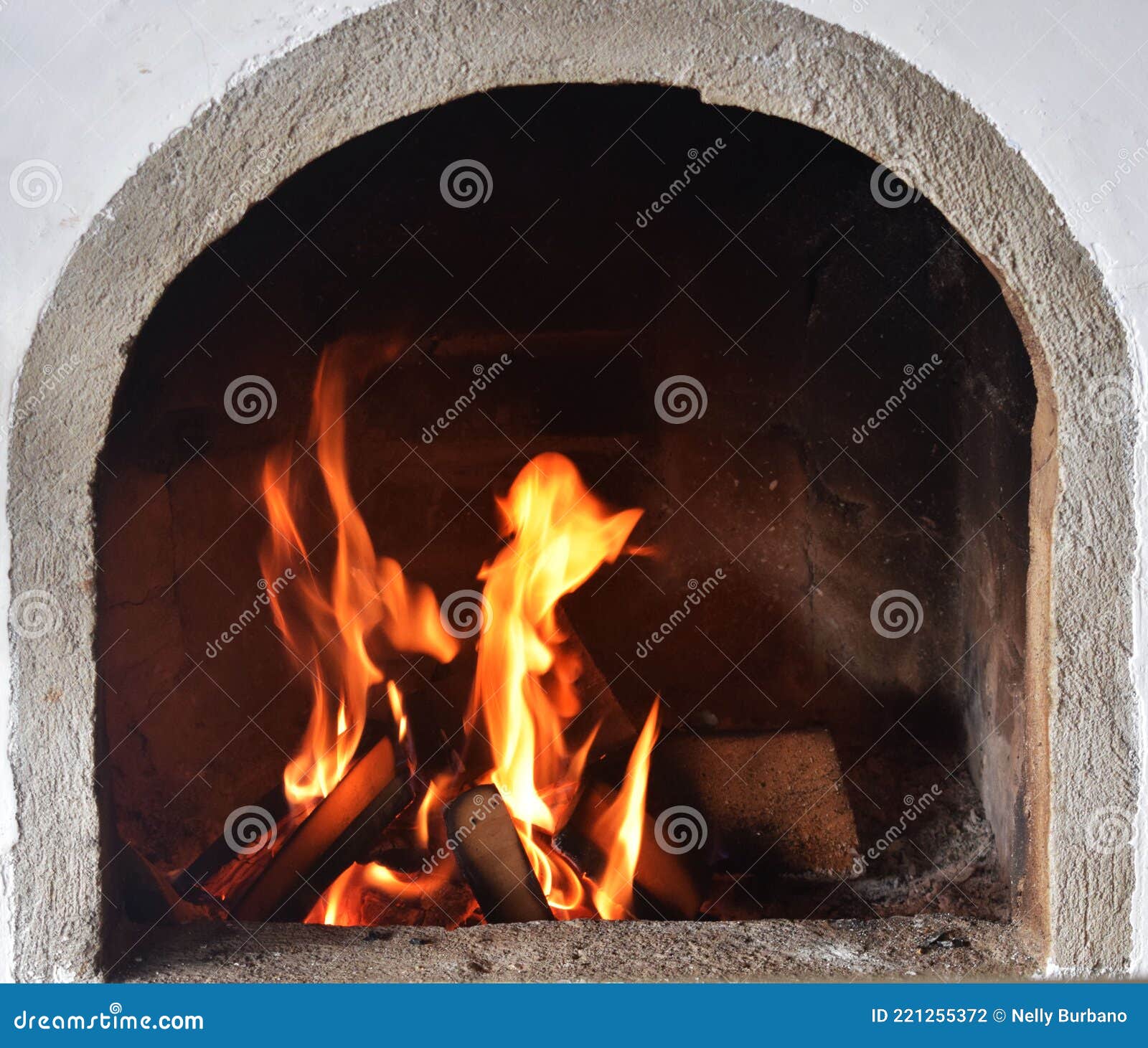 Fire in a small fireplace stock photo. Image of small - 221255372